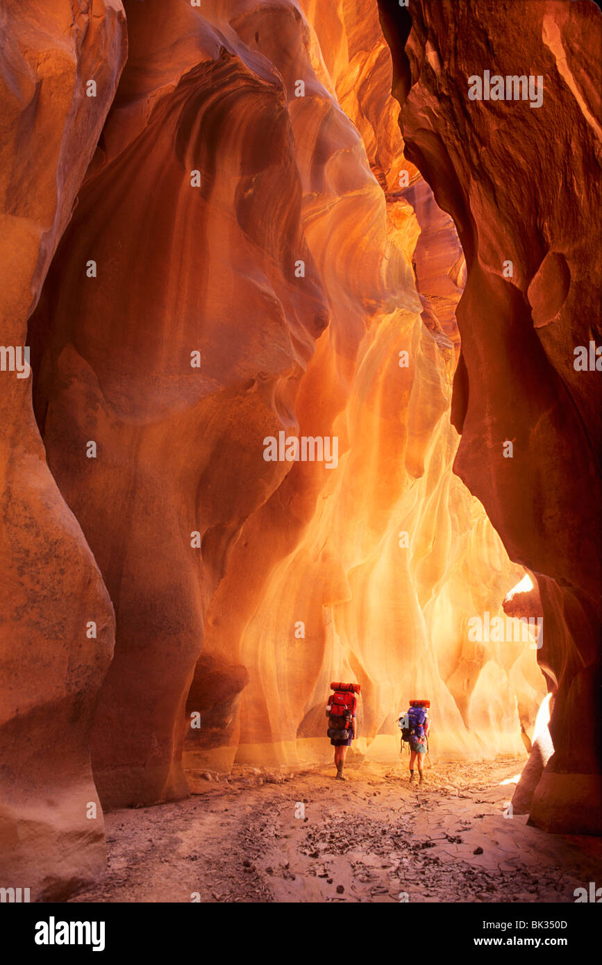 Two hikers pause along Buckskin Gulch in the Paria Canyons Wilderness Area in southern Utah ...