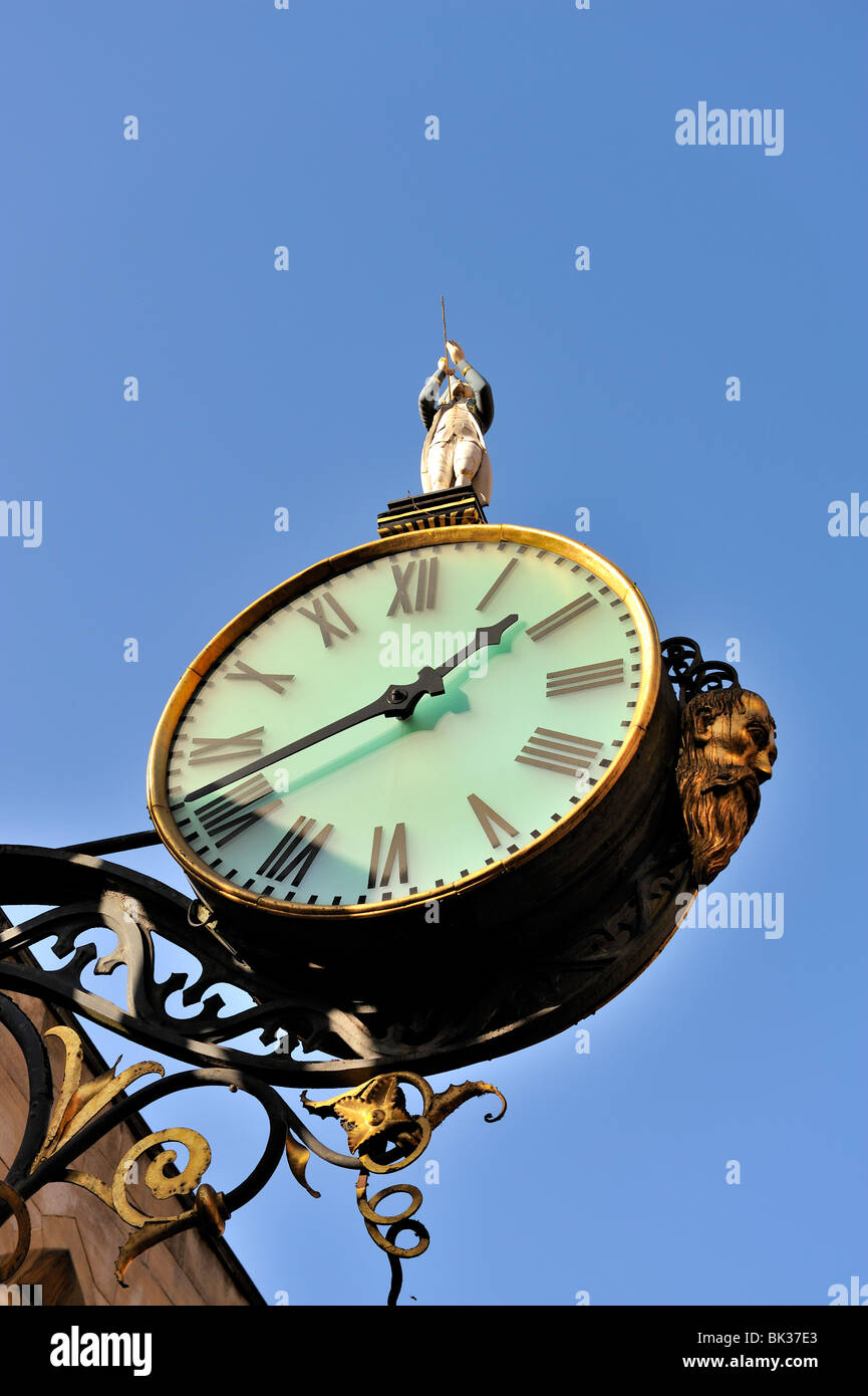 Public clock with statue against blue sky York UK Stock Photo - Alamy