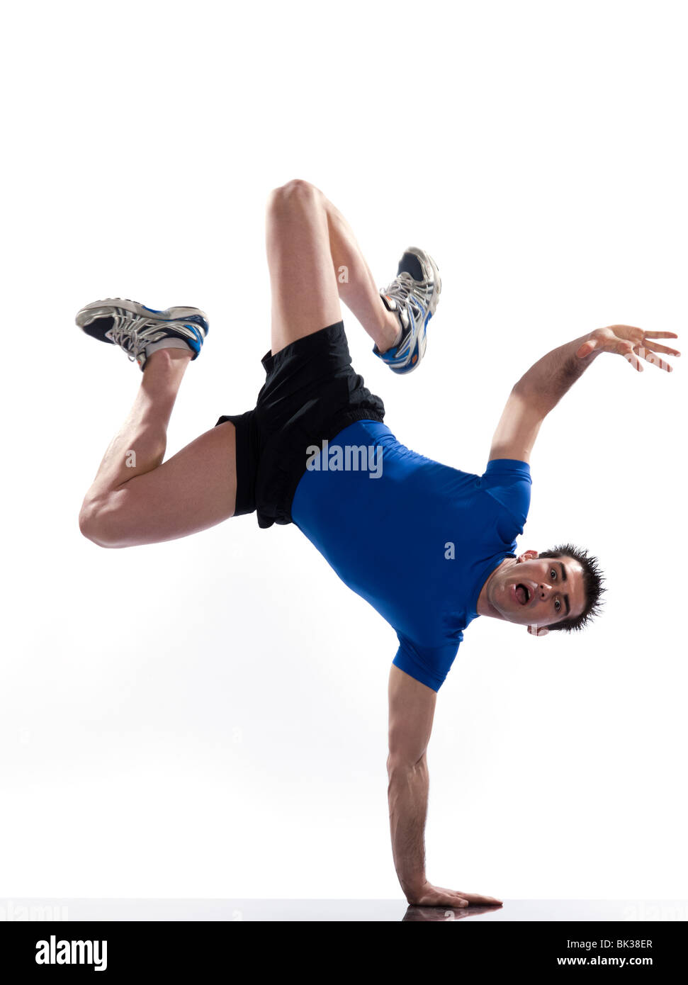 man acrobat on studio white isolated background Stock Photo - Alamy