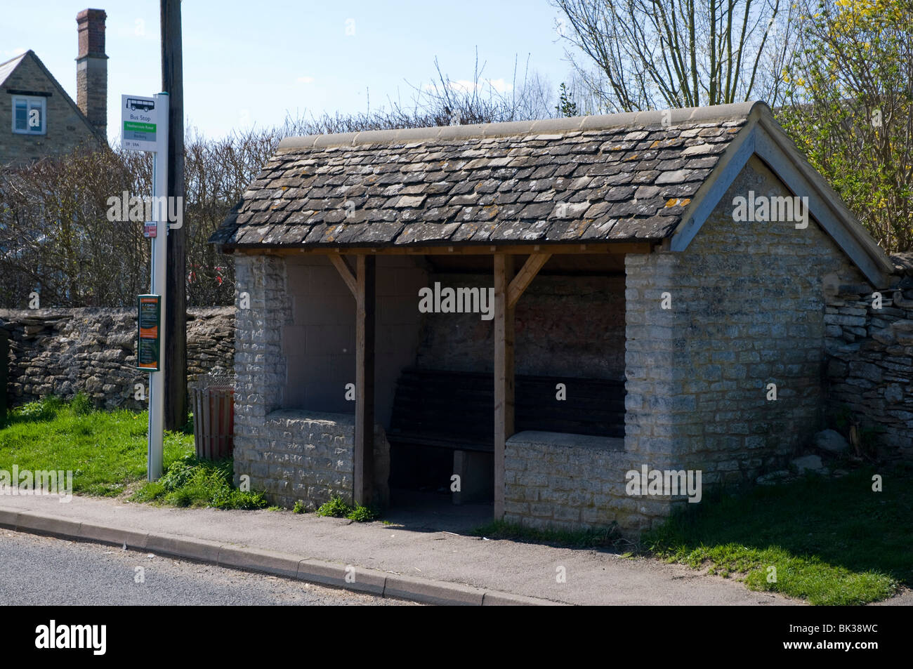 A rural bus shelter in the cotswolds with new bus-stop sign Stock Photo ...