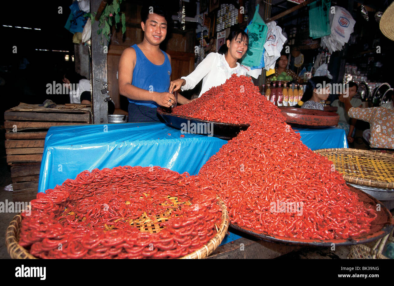 Vendor selling red peppers, Myanmar Stock Photo - Alamy