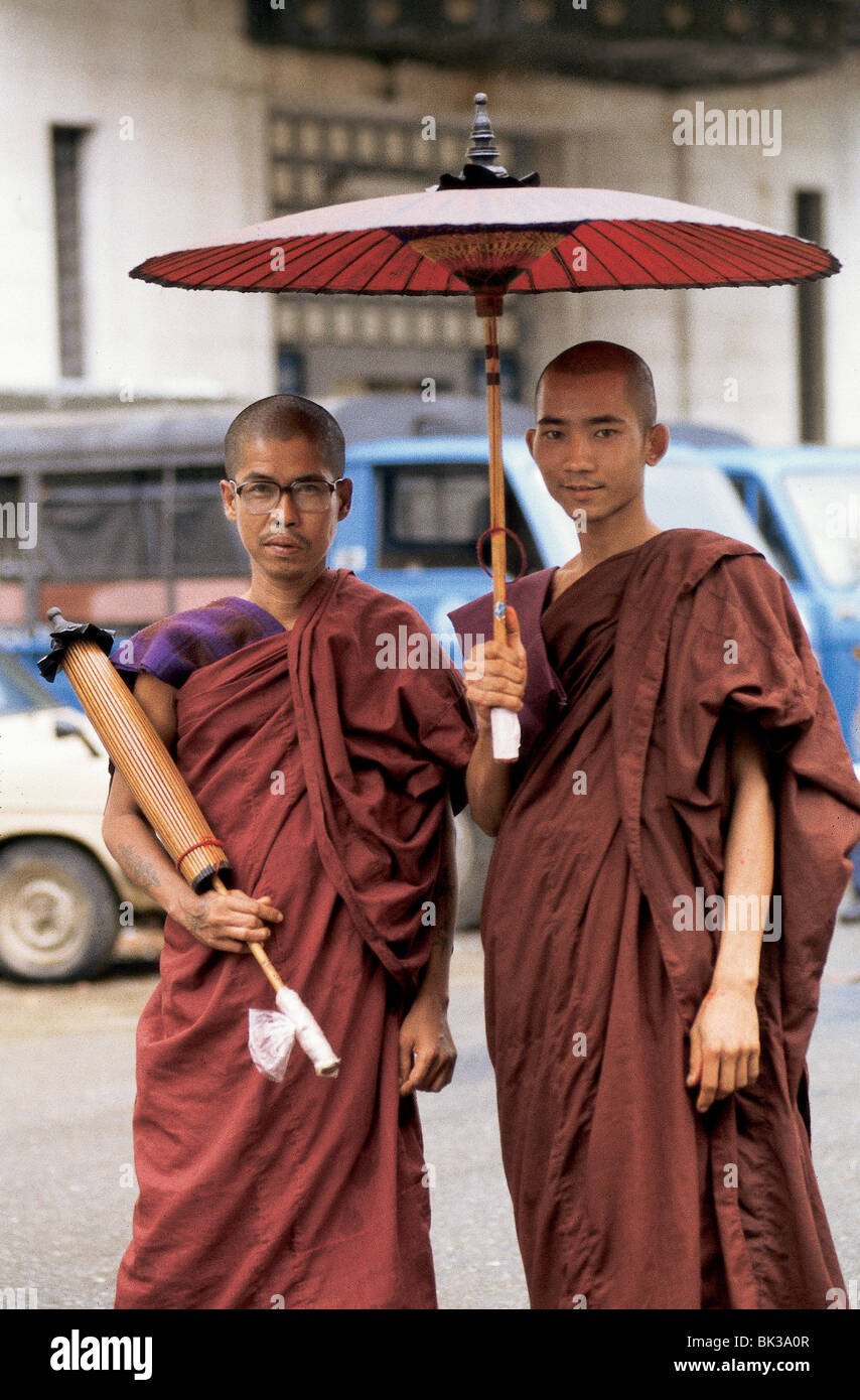 Two burmese buddhist monks portraits hi-res stock photography and ...