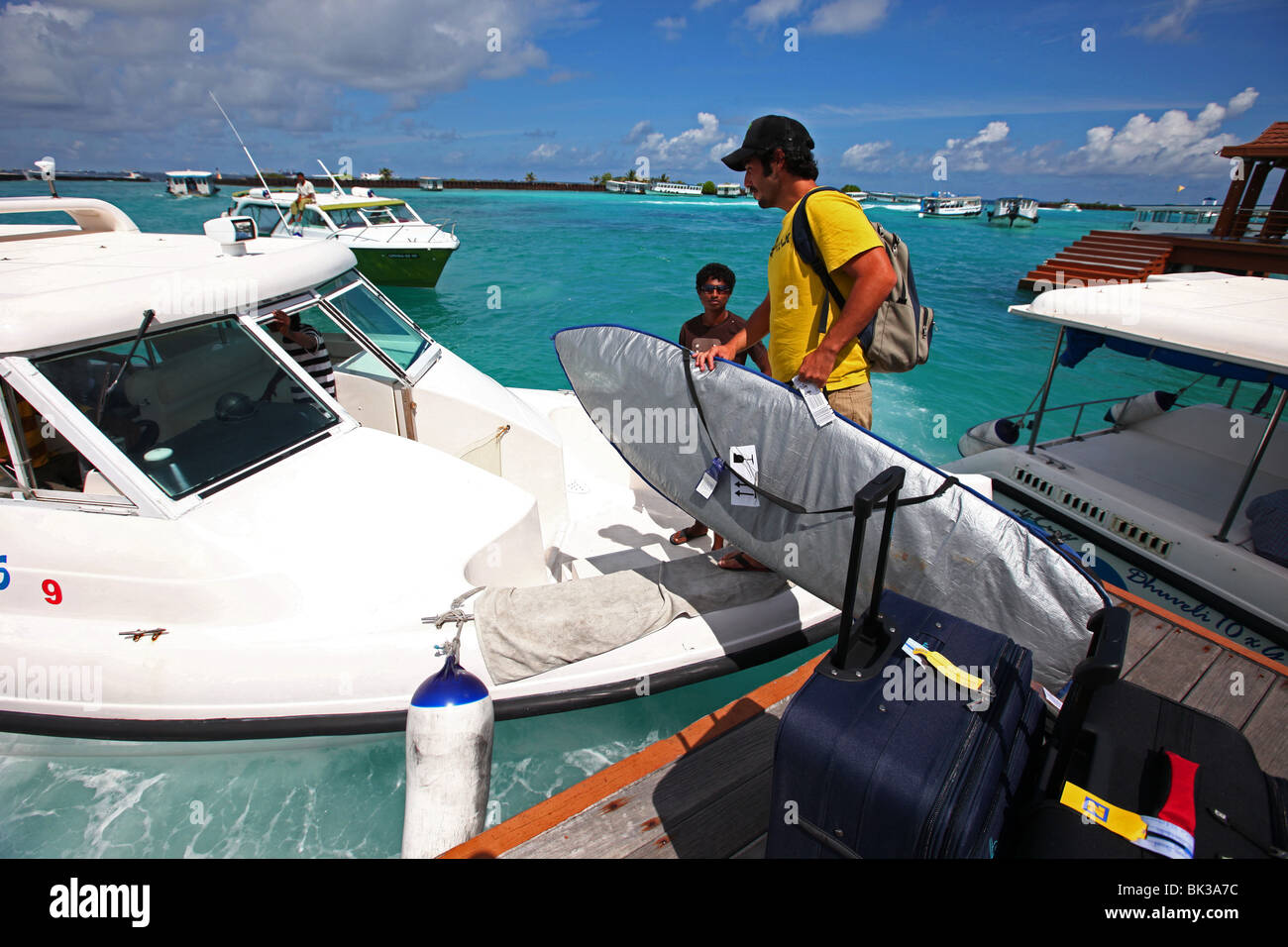 MALDIVES, Male: A surfer with his surfboard luggage booked a transfer ...