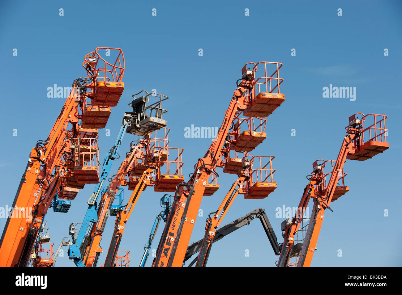 Hydraulic Platform cages against blue sky Stock Photo - Alamy