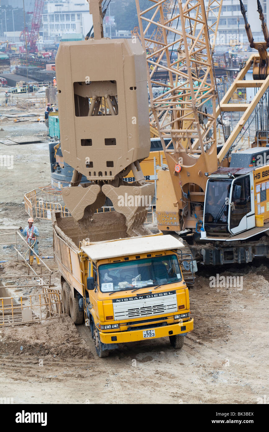 Digging pilings on a construction site in hong Kong, China Stock Photo ...