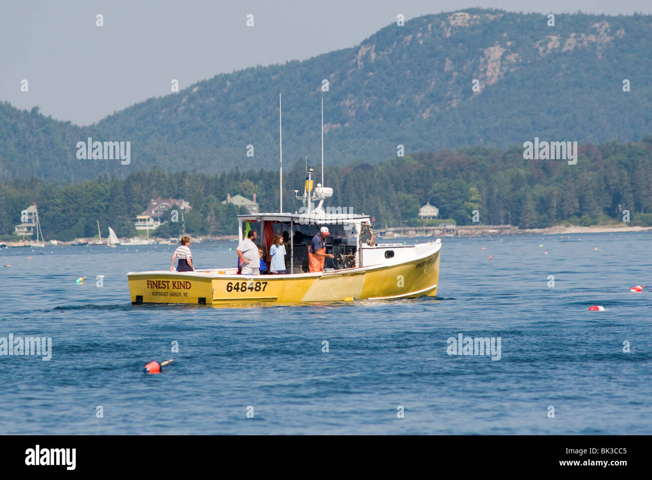 Family lobstering lessons Stock Photo - Alamy