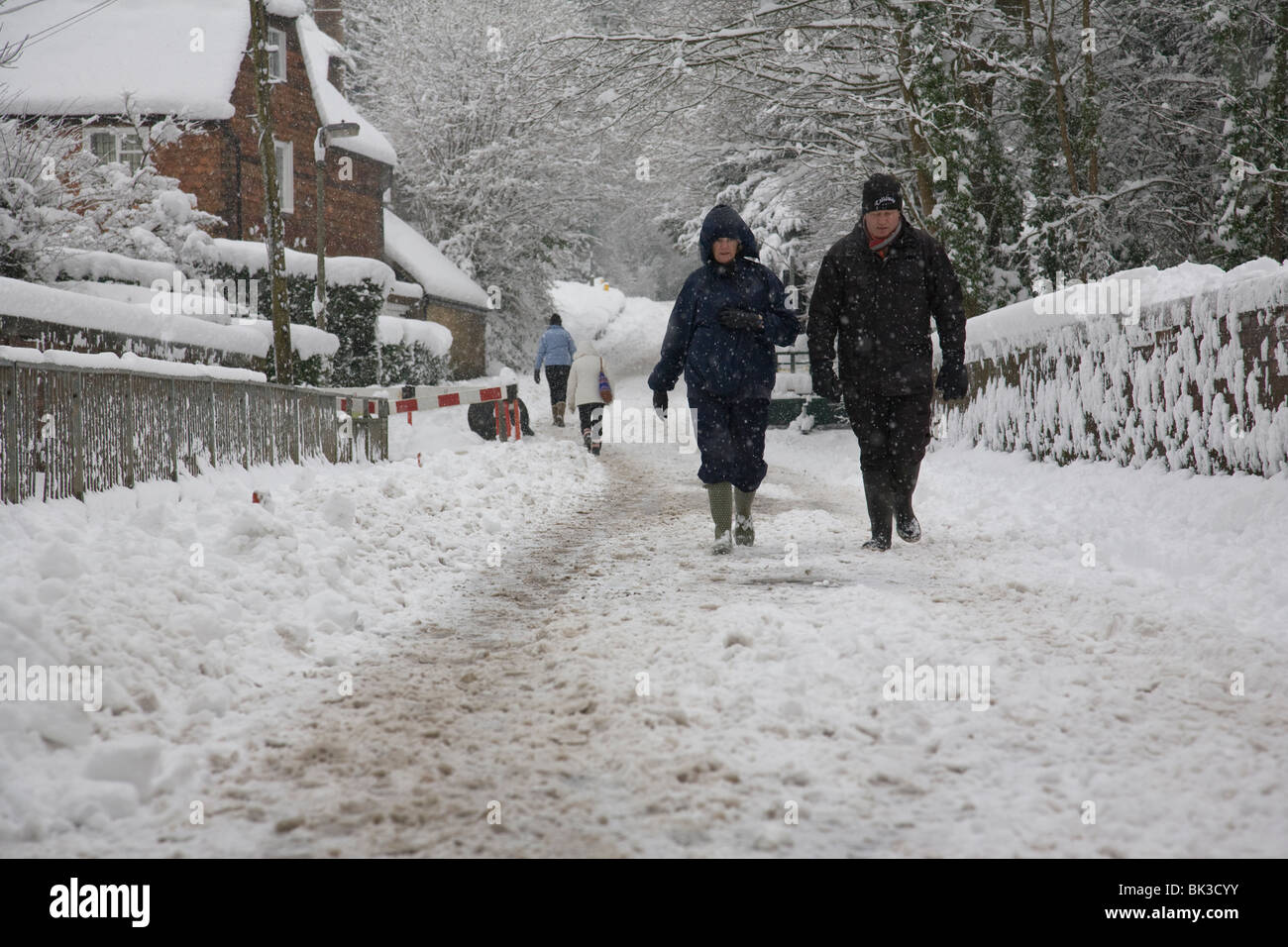 Man walking along road covered snow hi-res stock photography and images ...