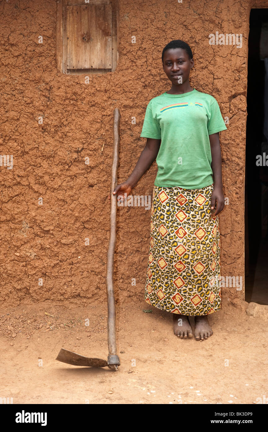 Rwandan woman outside her home with a hoe. Rwanda Stock Photo - Alamy