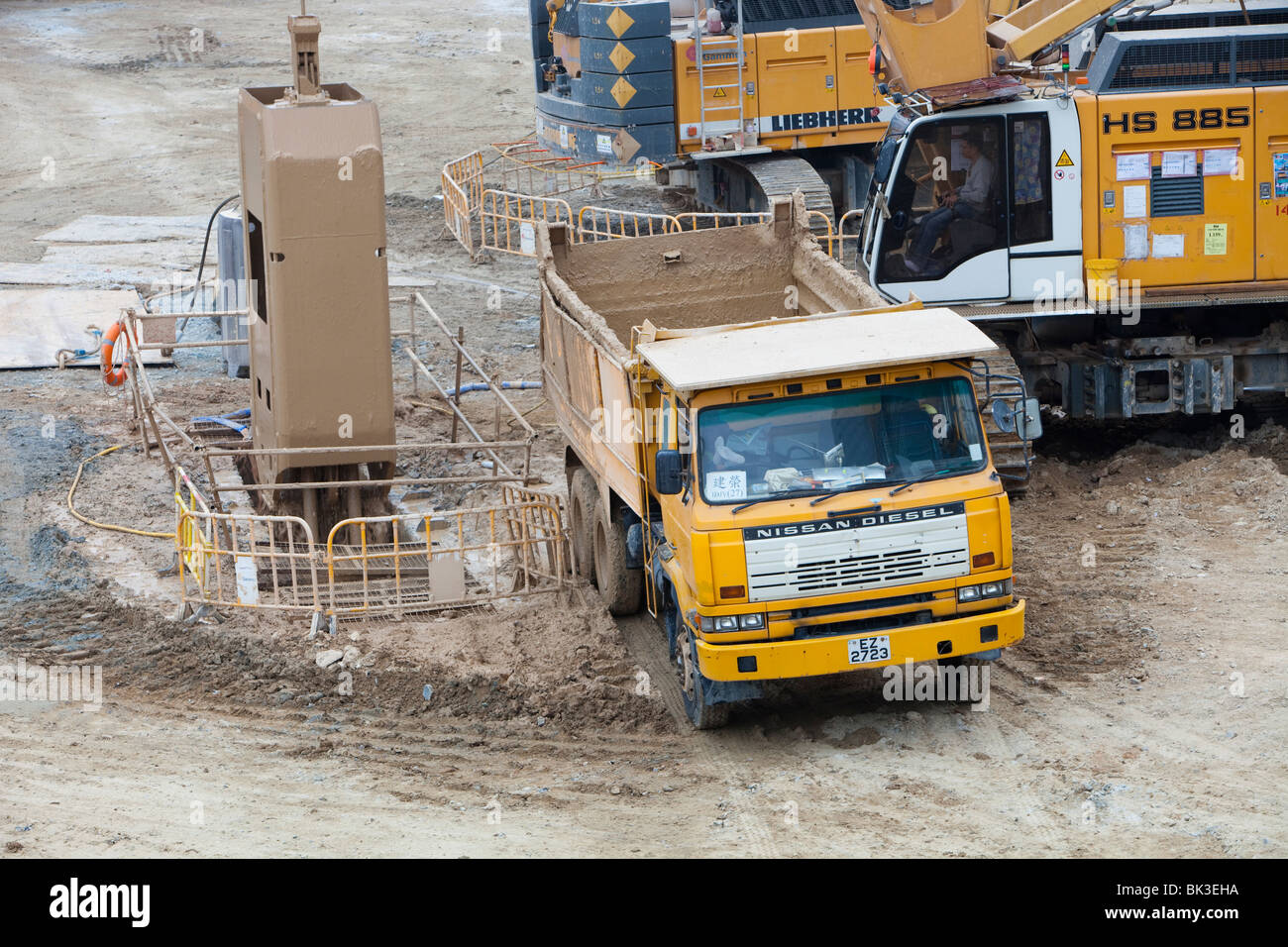 Digging pilings on a construction site in hong Kong, China Stock Photo ...