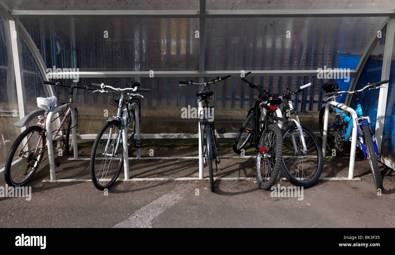 Bicycles Under Bike Shelter Stock Photo - Alamy