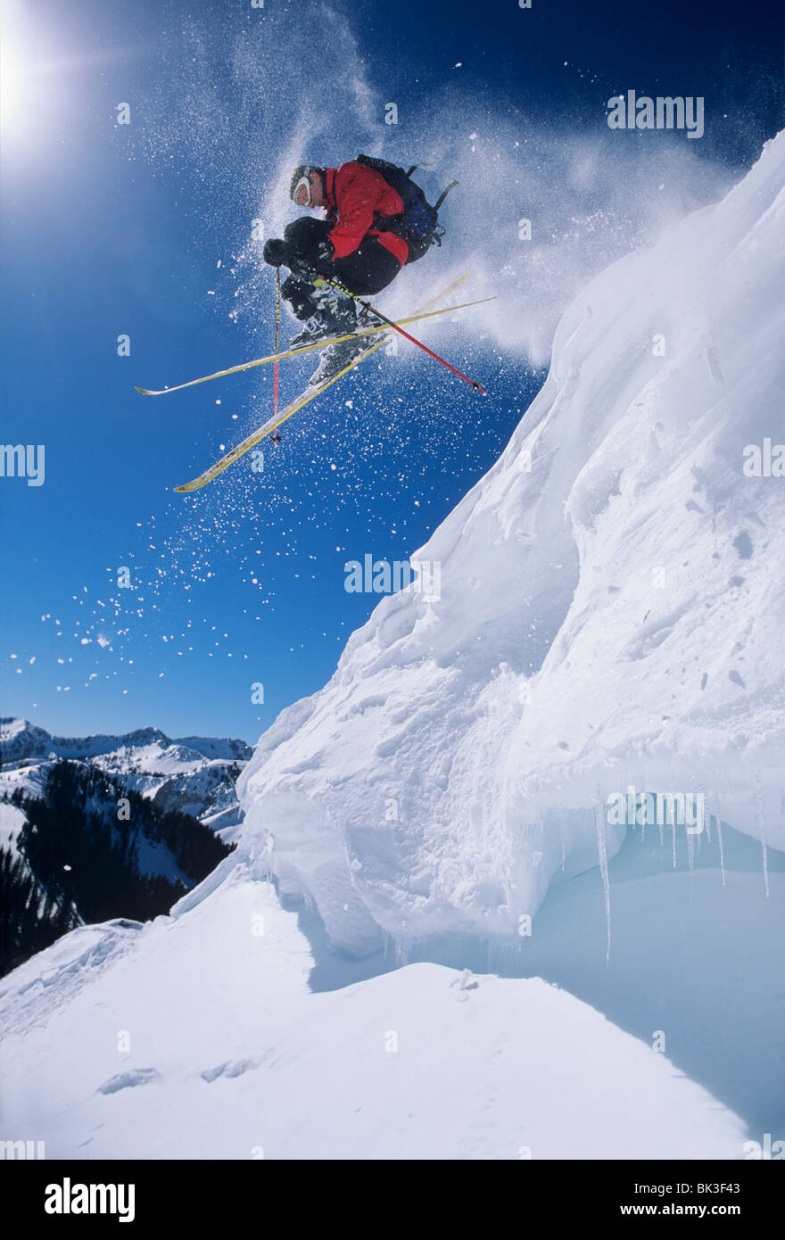 Man on skis jumping off a huge cornice on Clayton Peak in Big ...