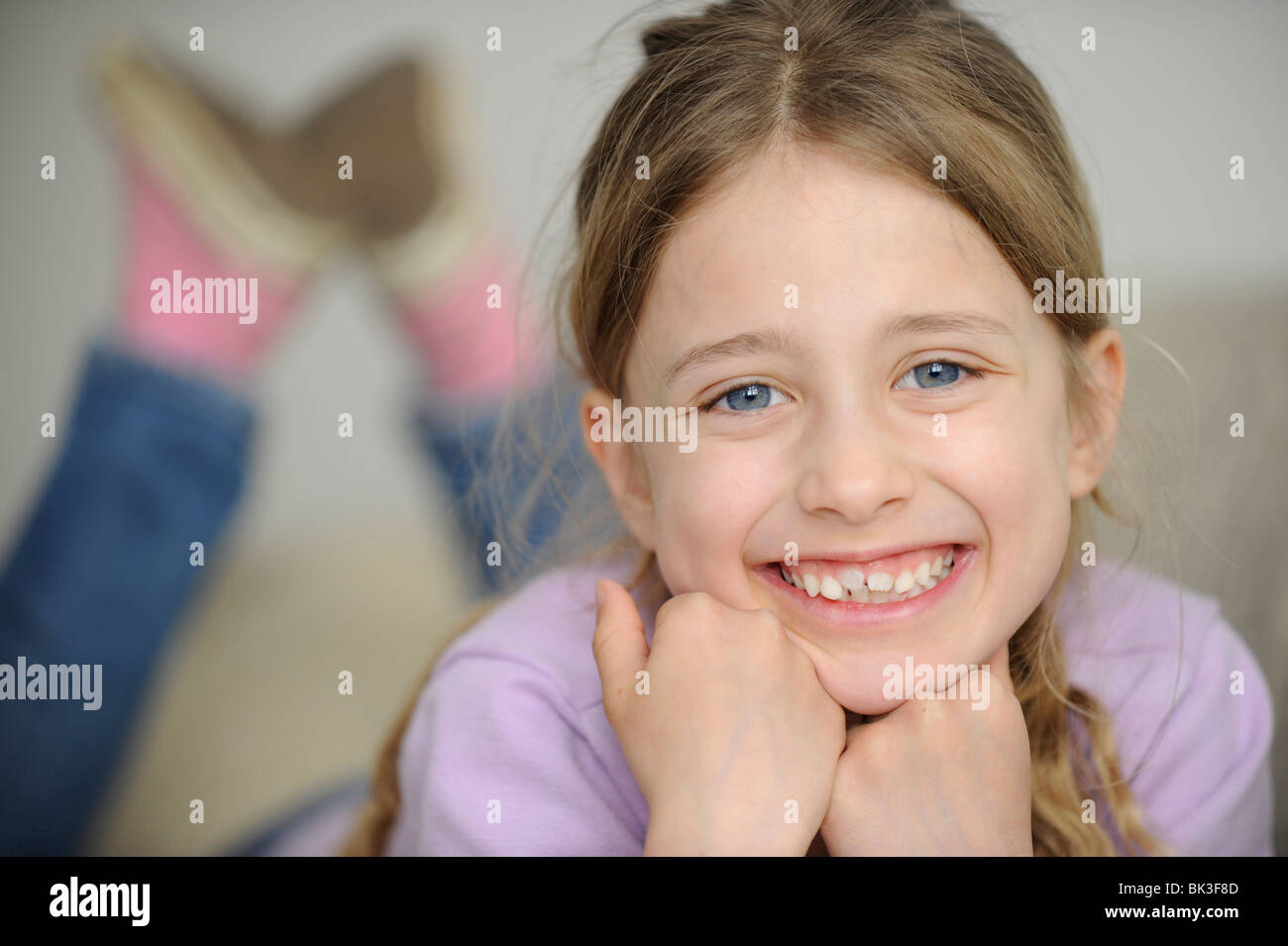 Portrait of a smiling girl of eight years Stock Photo - Alamy