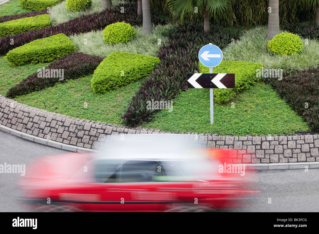 Taxi going round a roundabout in Hong Kong, China Stock Photo - Alamy