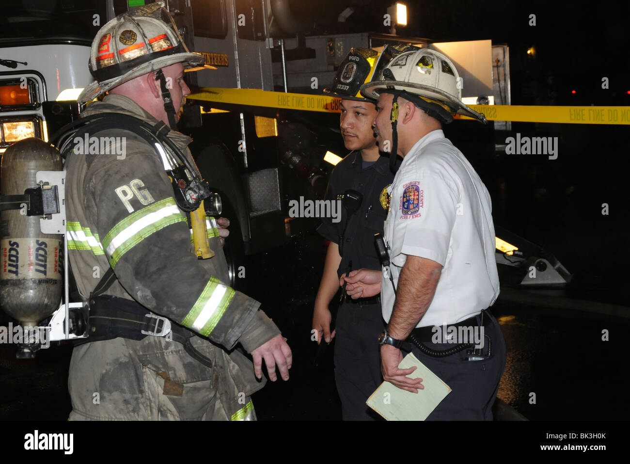 firefighters discuss strategy at the scene of a fire Stock Photo - Alamy