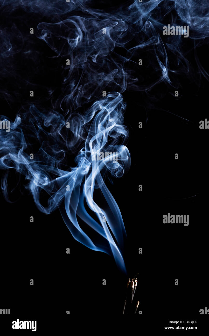 Incense smoke, abstract shape on black background Stock Photo - Alamy