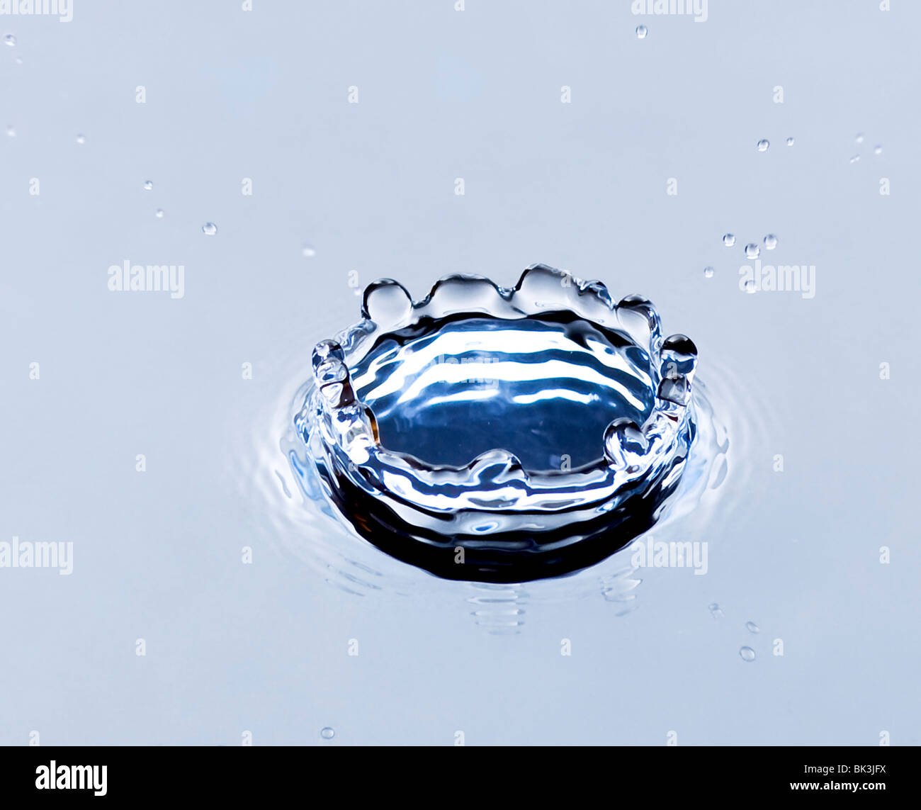 Black ball splash to water closeup drop coin in to water blue Stock ...