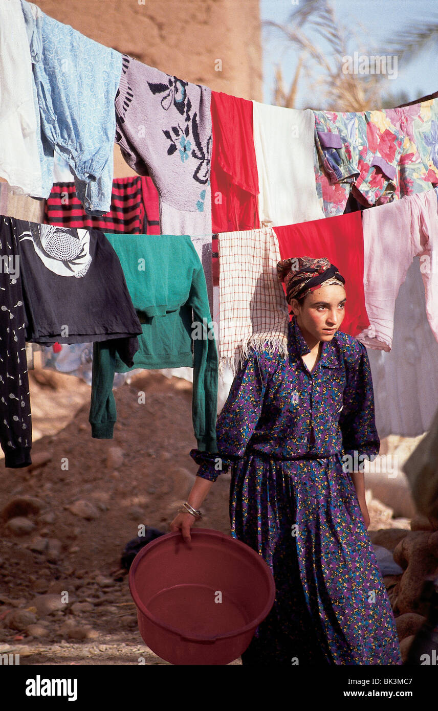Woman with drying laundry on a clothesline, Morocco Stock Photo - Alamy