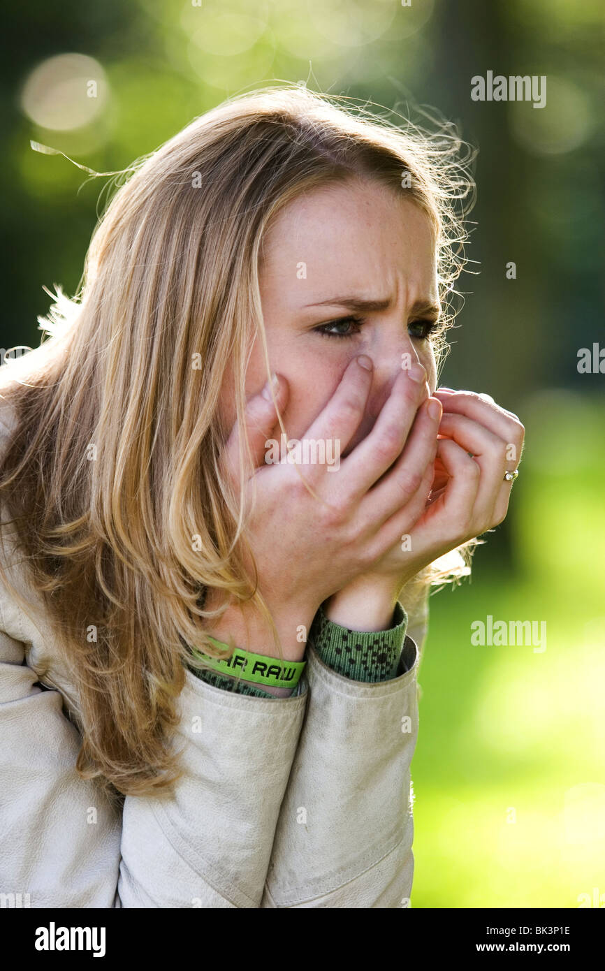 Woman hiding something real people hi-res stock photography and images ...