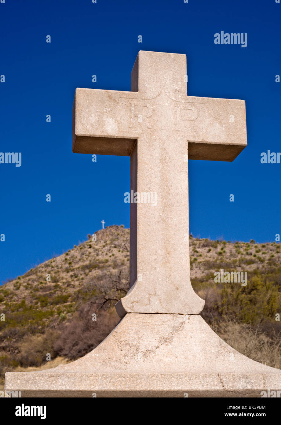 A near and far cross stand under a blue sky at the Santo Nino de Atocha ...