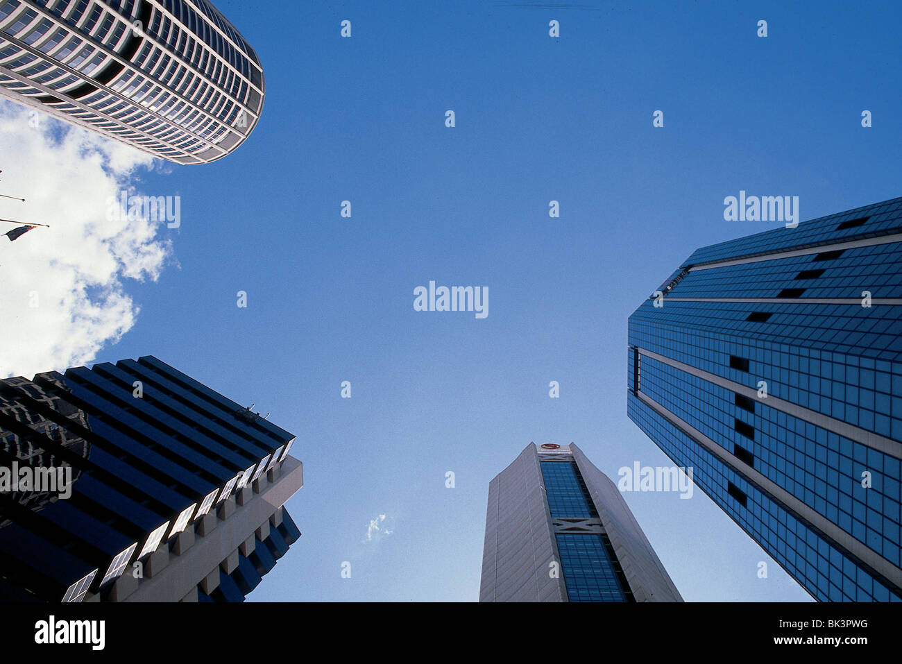 Looking up at tall hi-rise office buildings in central business ...