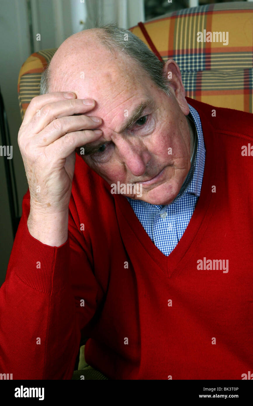 Sad man home alone Stock Photo - Alamy