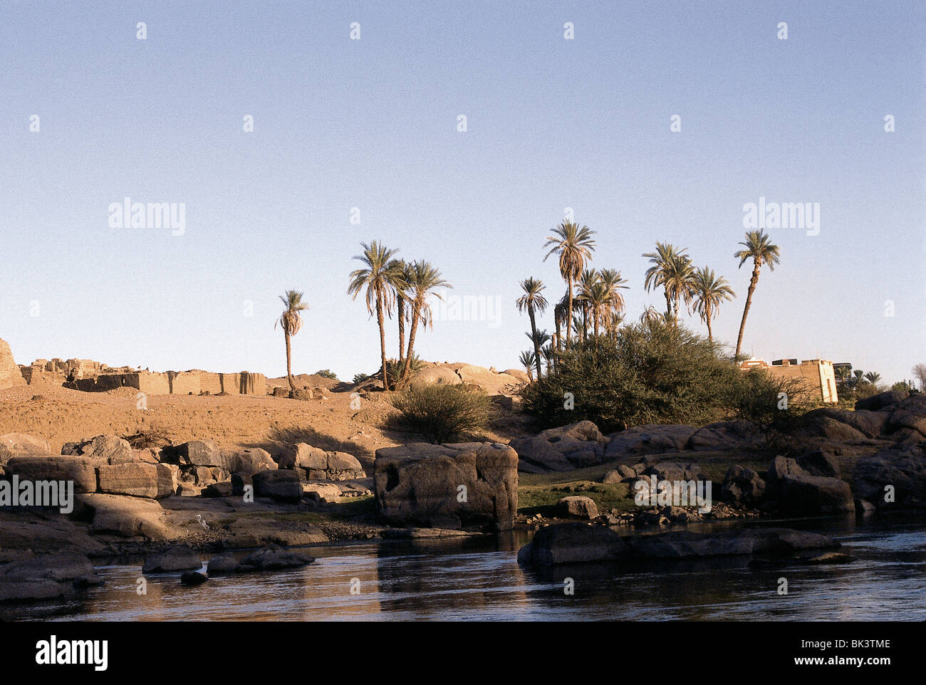 Rural landscape with historic site structures and palm trees along a ...