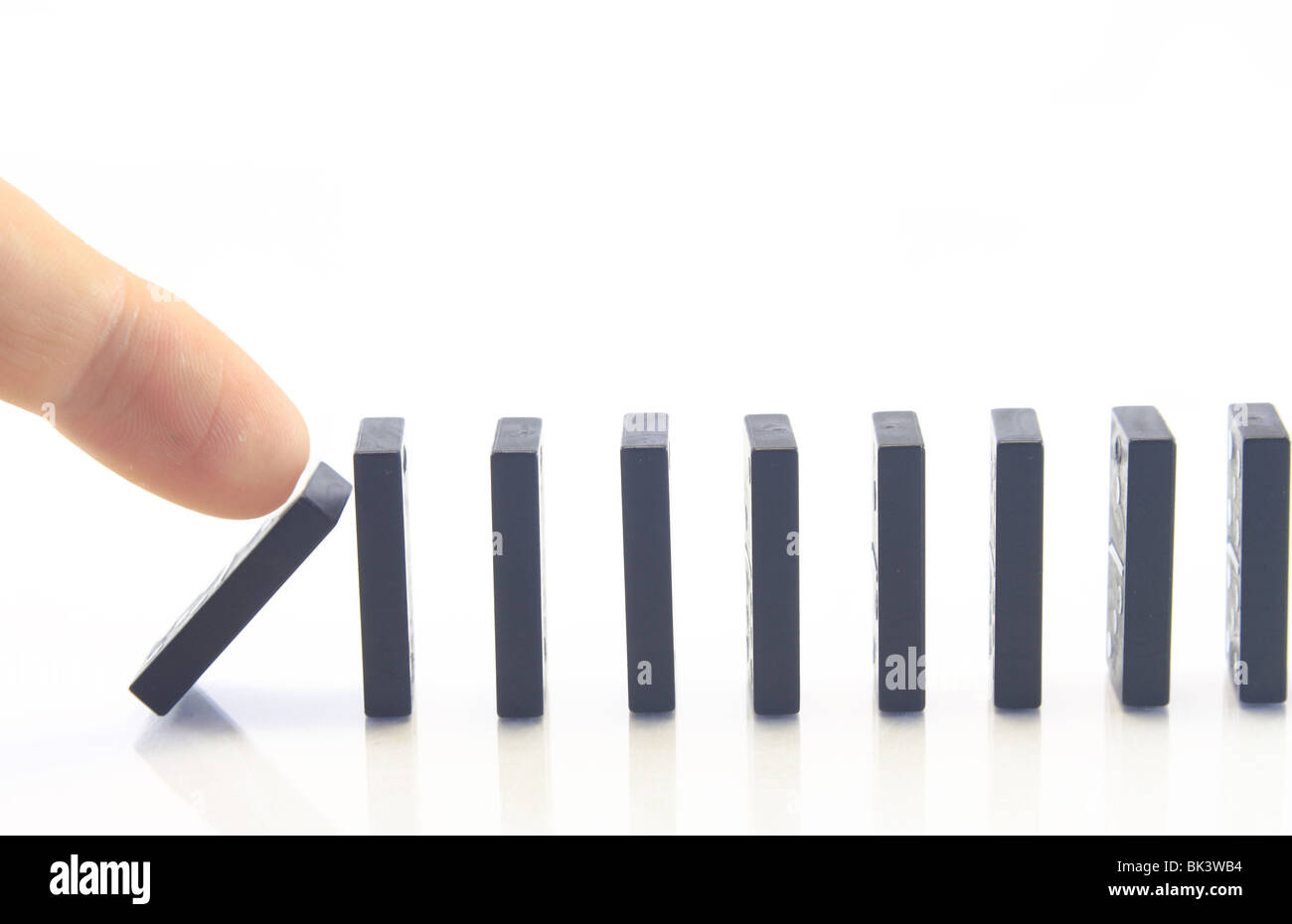Finger pushing dominoes hi-res stock photography and images - Alamy