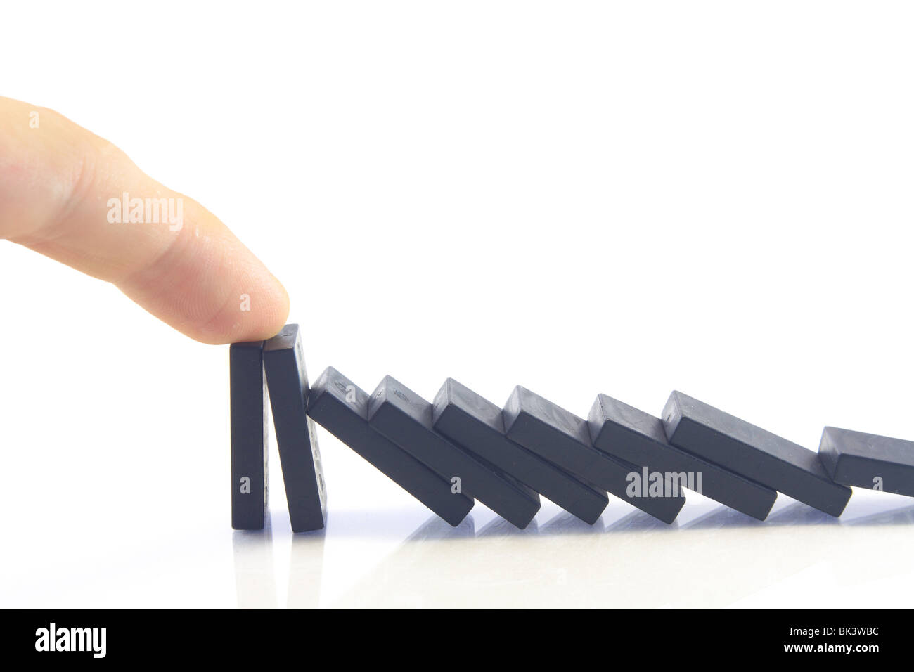 chains of falling domino isolated on a white background or concept of ...