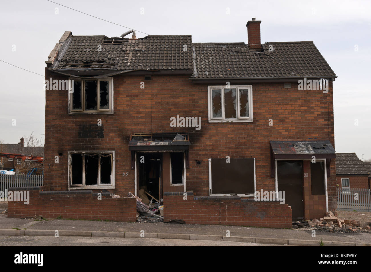 Burned out, derelict council houses Stock Photo - Alamy