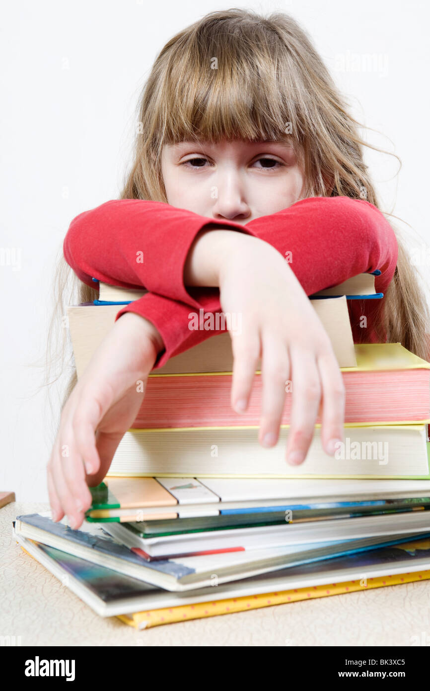 Is it possible to read all these books? little cute sad girl with a ...