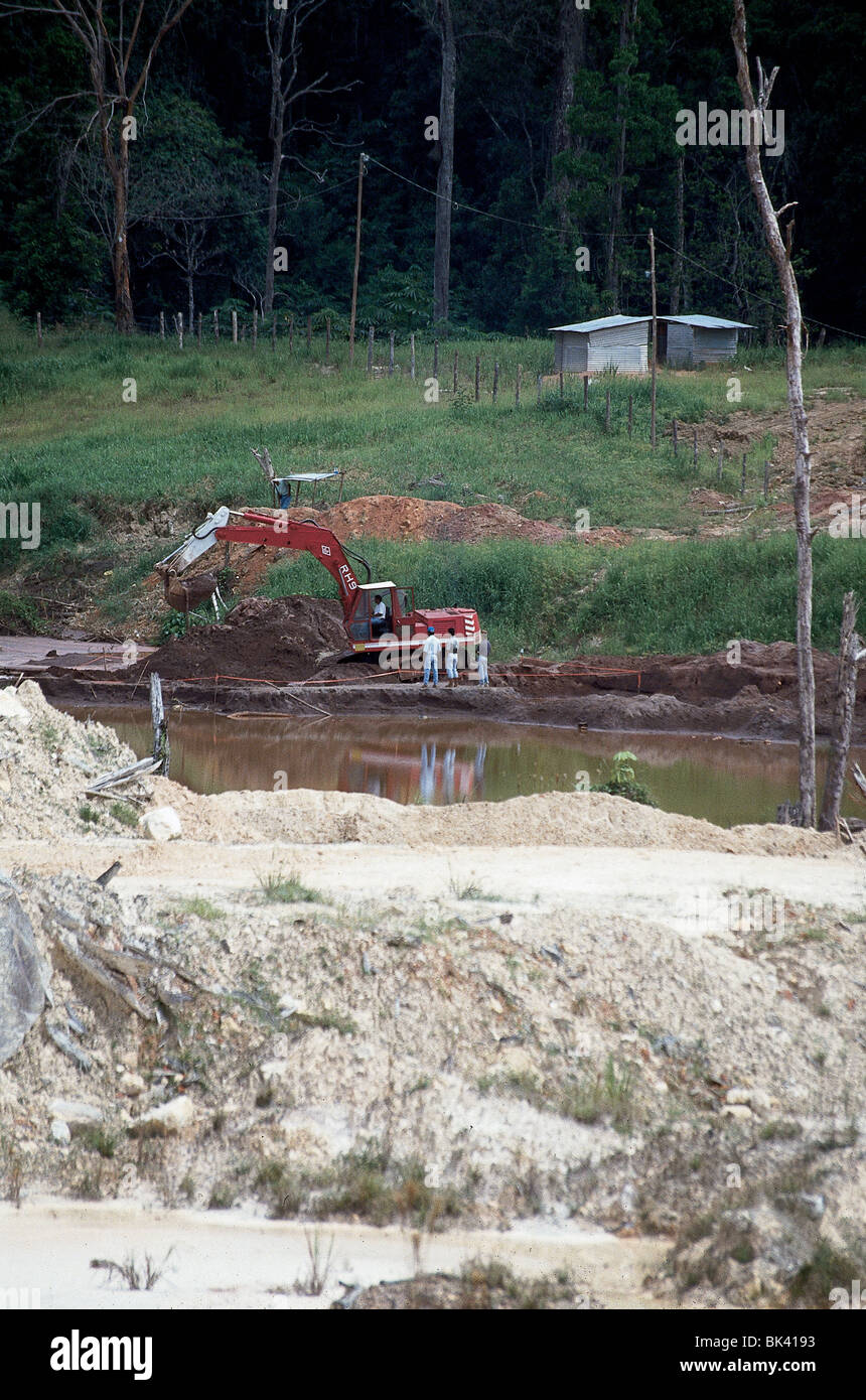Gold mining with a backhoe machine in the Amazonas State, of Venezuela ...