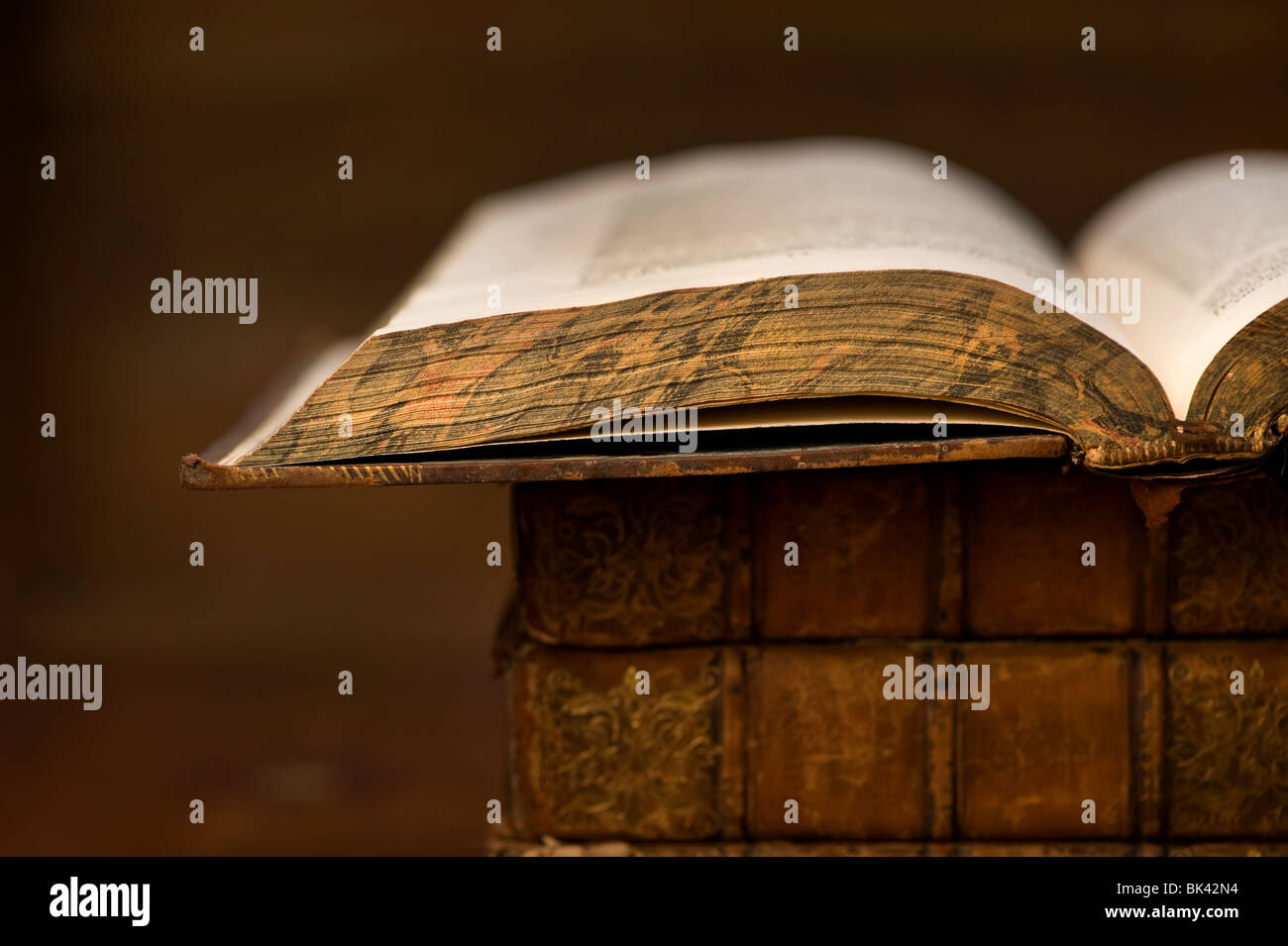 Antique, open, book, ready to read in dark wood environment Stock Photo ...