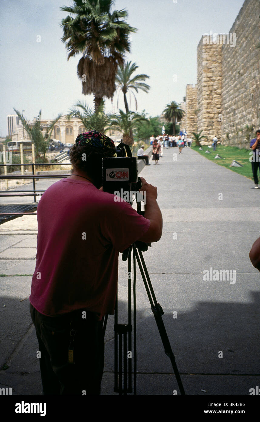 CNN cameraman filming near the old city walls of Jerusalem, Israel ...