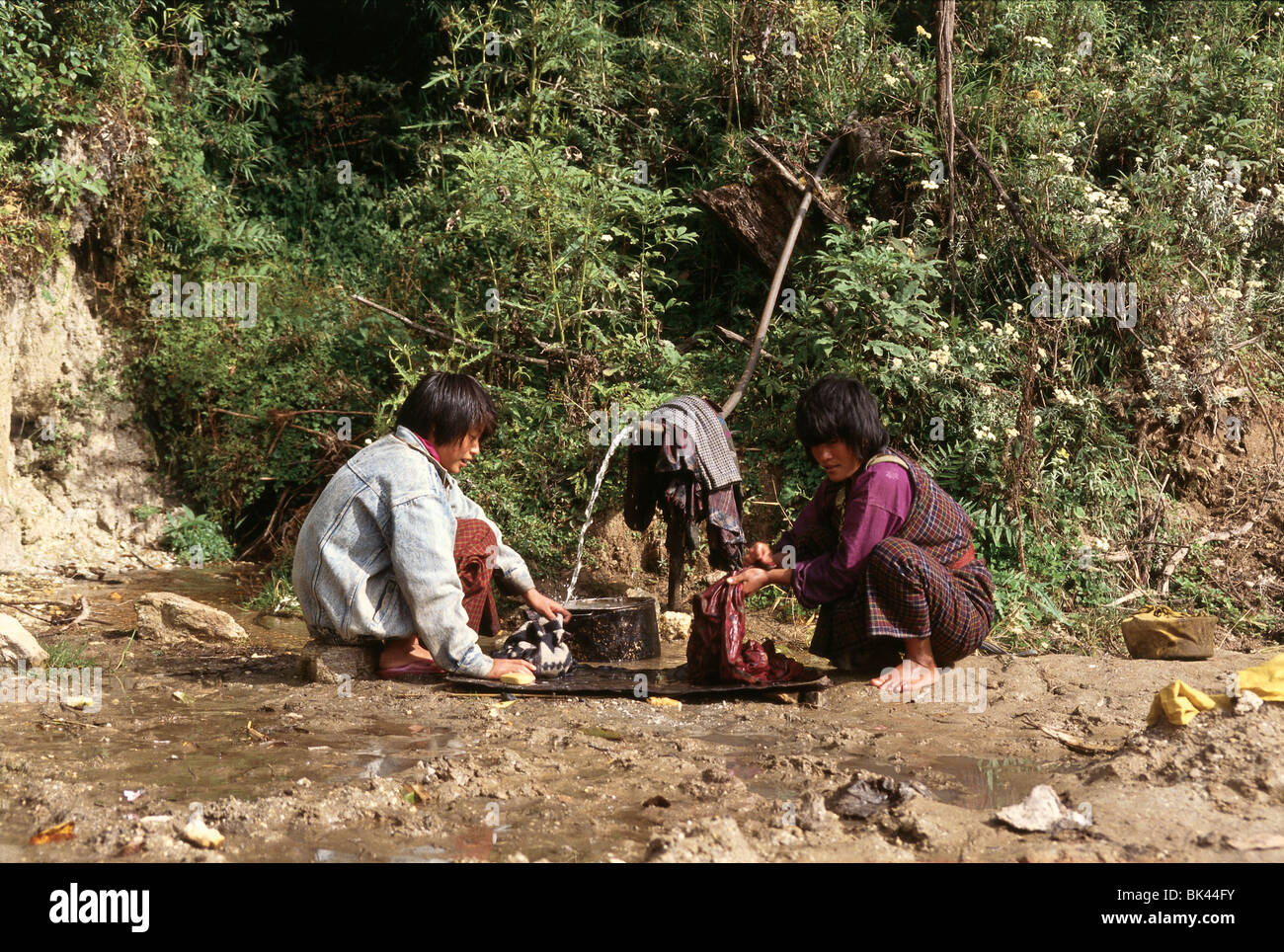 Washing clothes, Trongsa District, Kingdom of Bhutan Stock Photo - Alamy