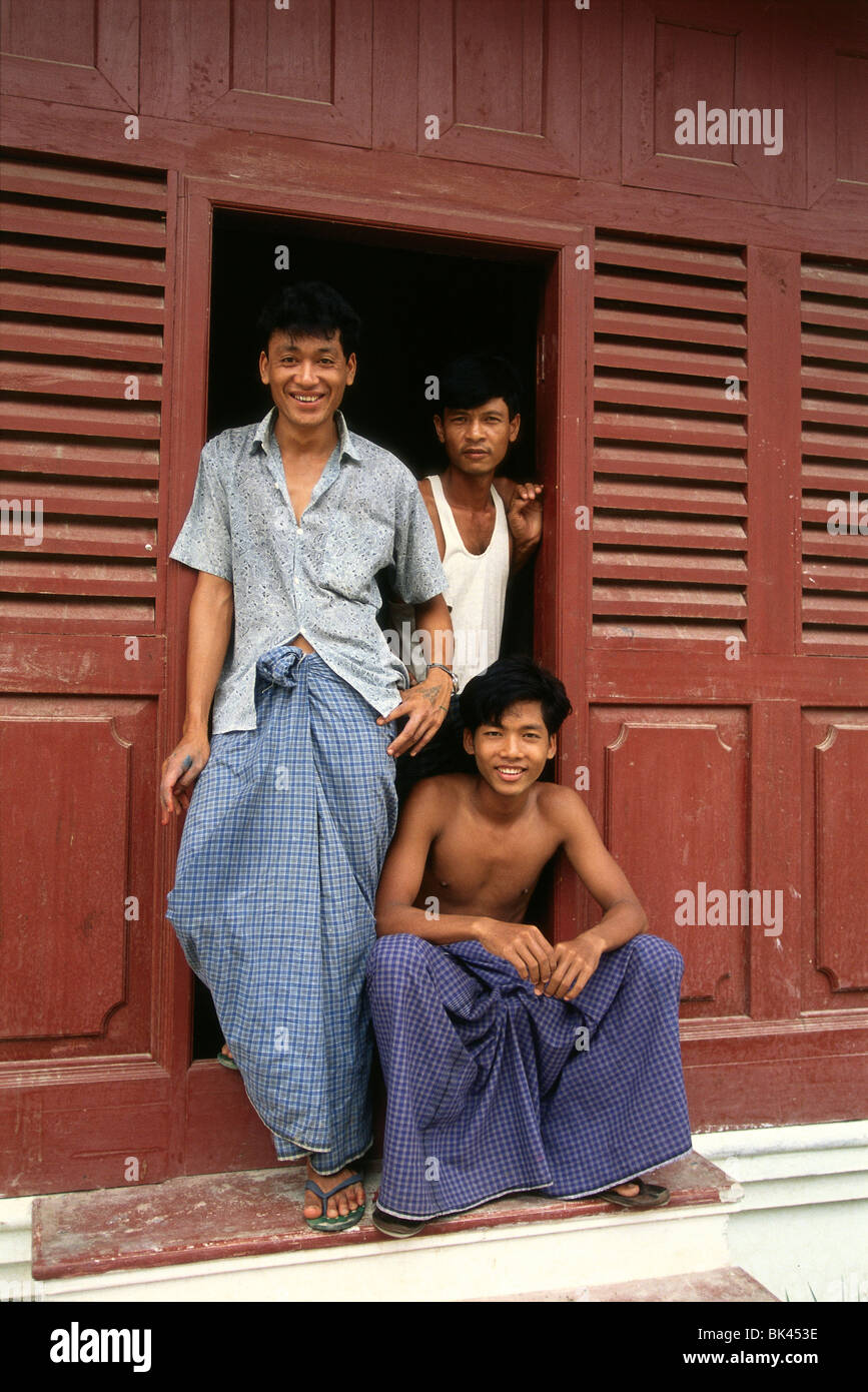 Young men in doorway, Myanmar Stock Photo - Alamy