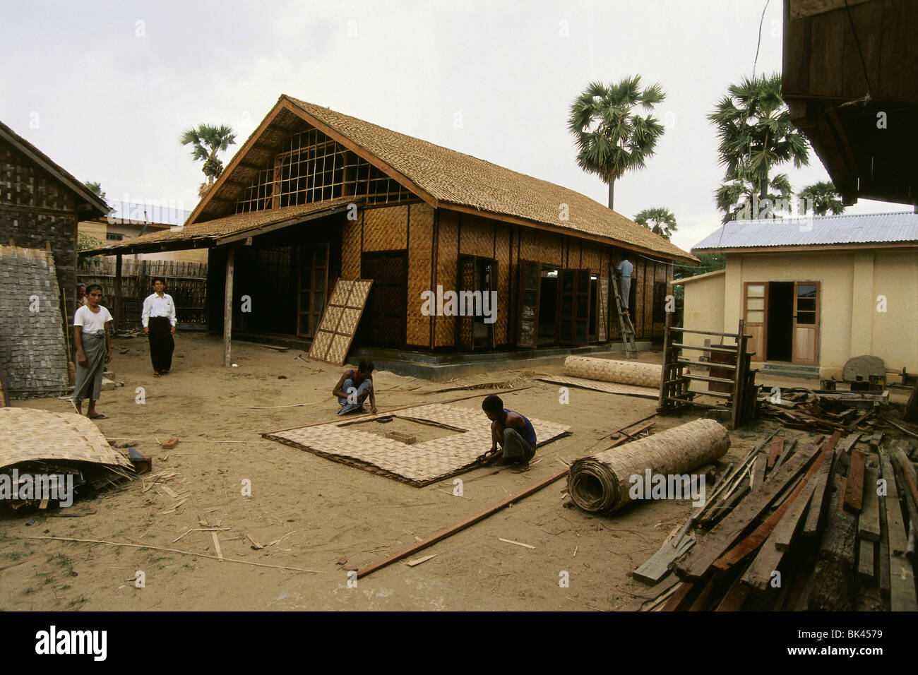 Building construction using rolls of split bamboo, Myanmar Stock Photo ...