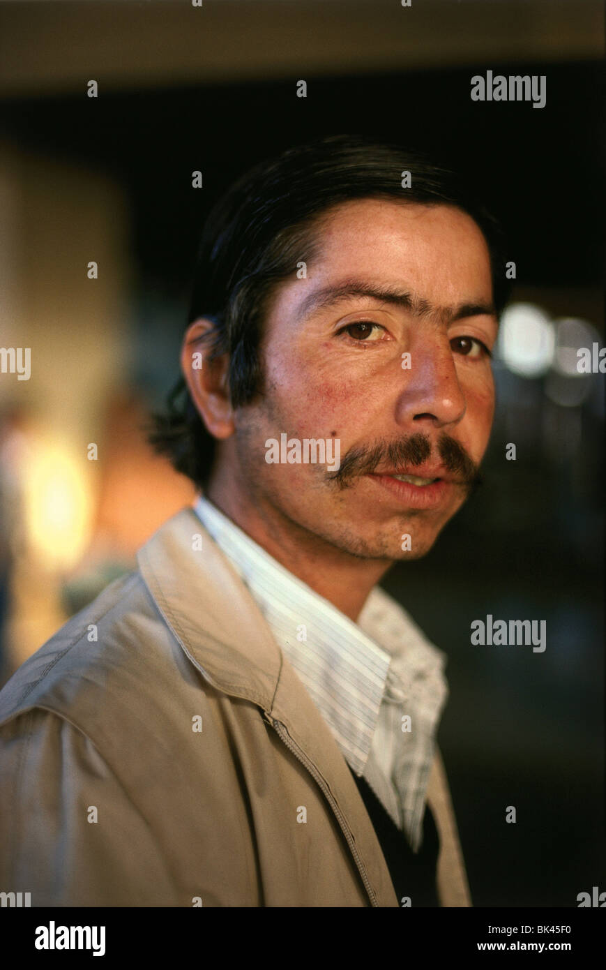 Hispanic young man serious expression hi-res stock photography and ...