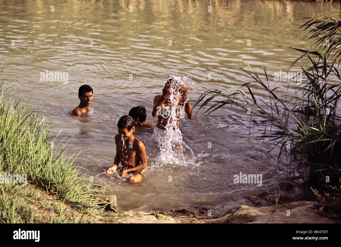 Boys cooling-off in a river near Baghdad, Iraq Stock Photo - Alamy