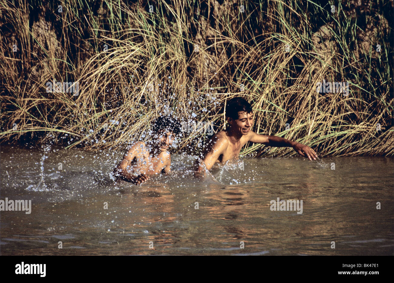 Two boys splashing in the river hi-res stock photography and images - Alamy