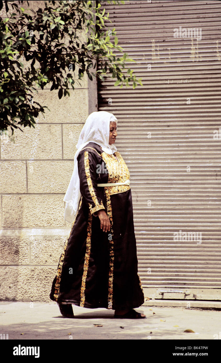 Full-length portrait of a woman wearing traditional clothing in Amman ...
