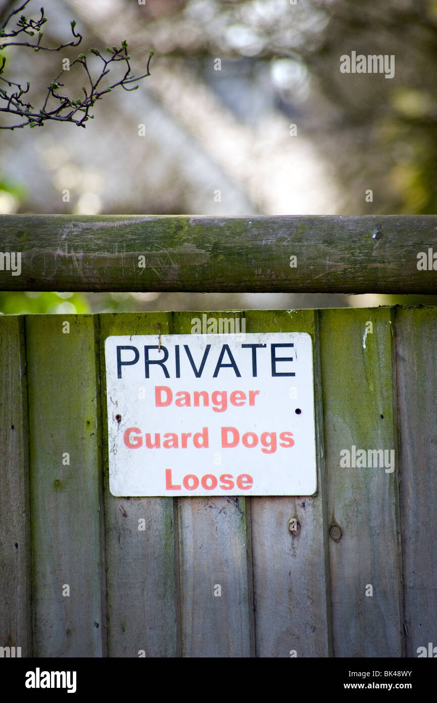 dog warning sign on wooden garden gate Stock Photo - Alamy