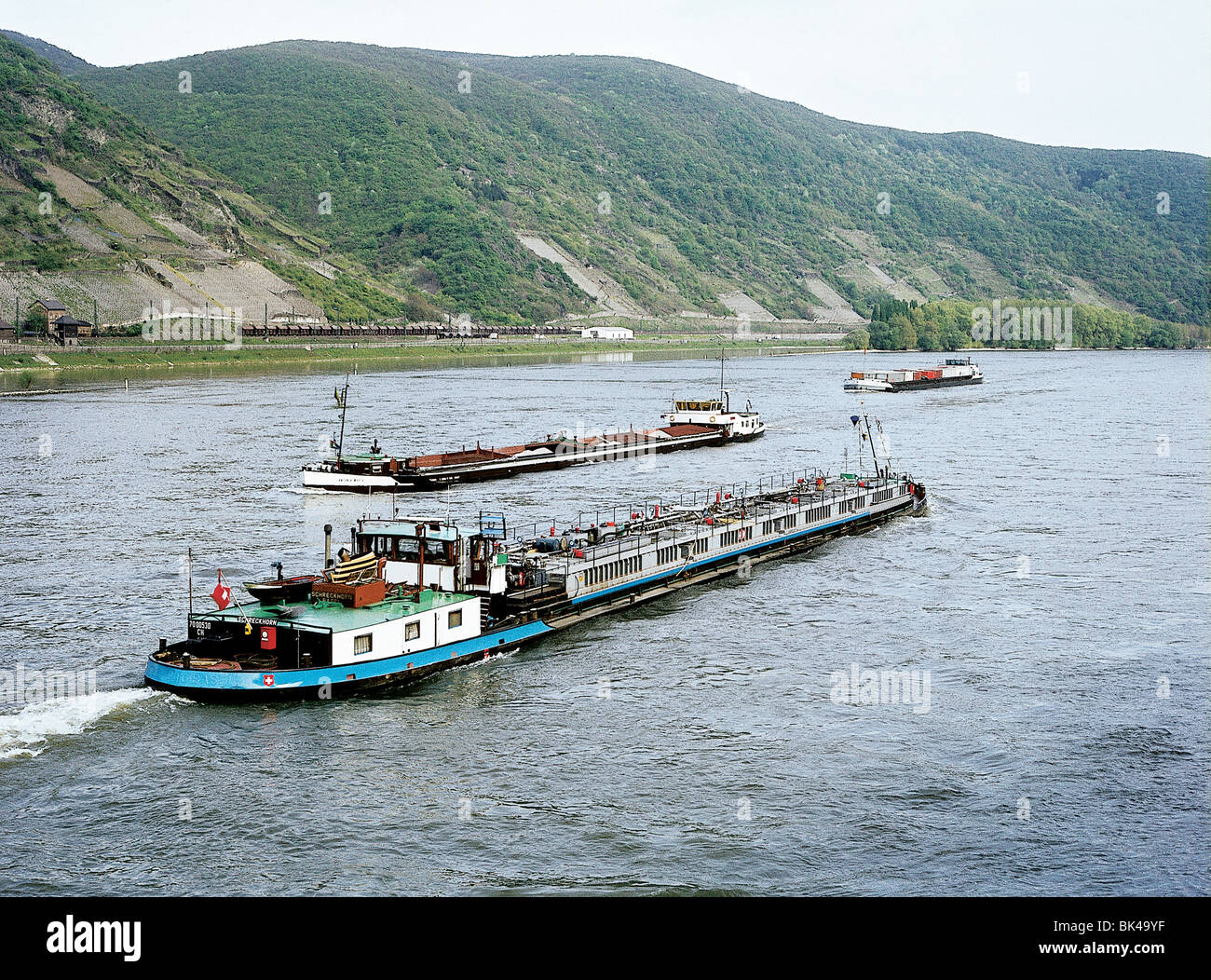 A Swiss barge (Schreckhorn) and other barges on the Rhine River near ...