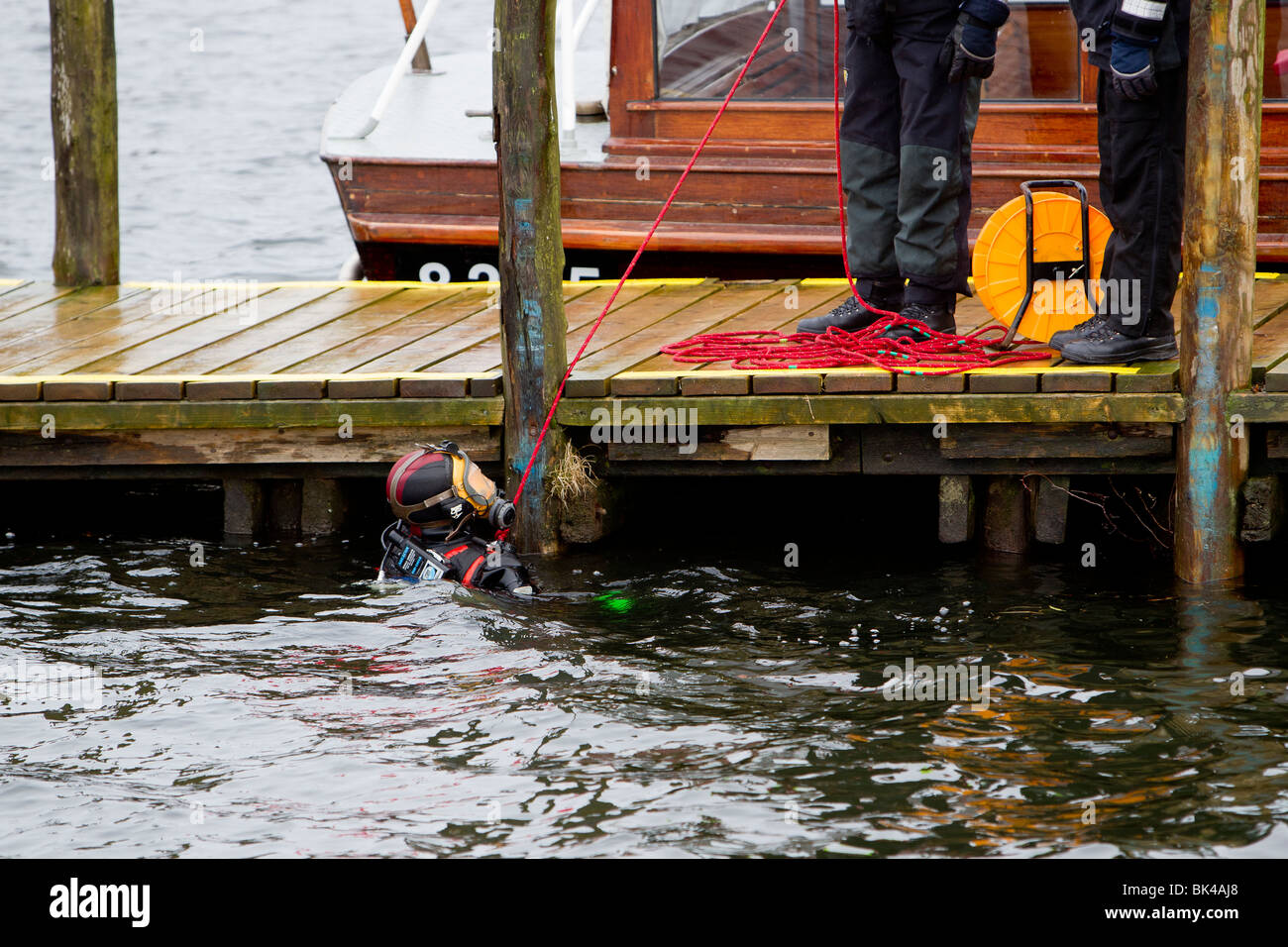 Police *Heddlu Underwater Search & Marine Unit checking Lake bed before ...