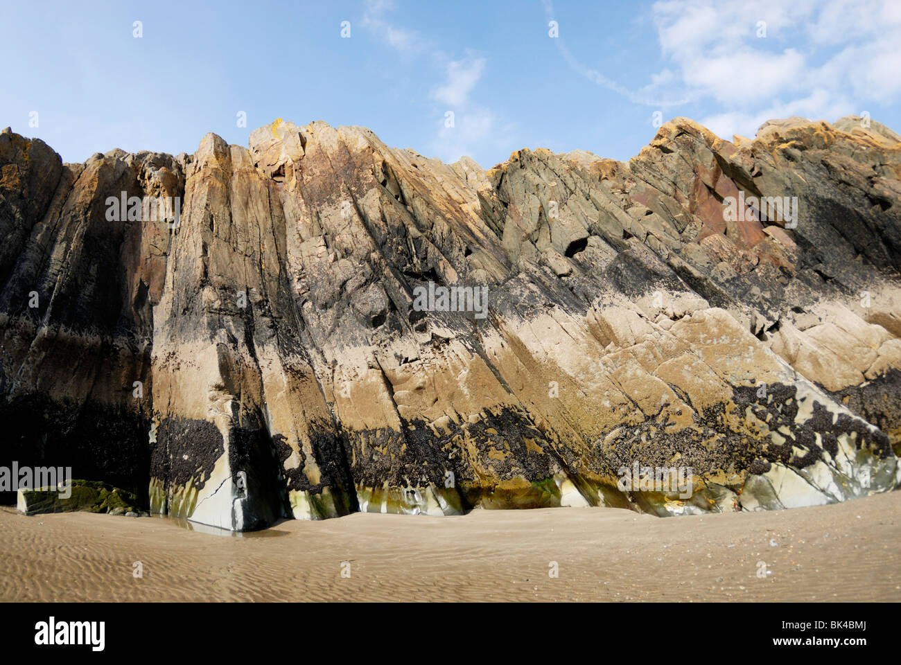 Sea cliff showing rock strata & layers together with tidemarks Stock ...