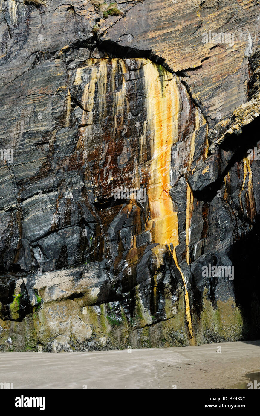 Mineral staining on a rockface on a sea cliff Stock Photo - Alamy