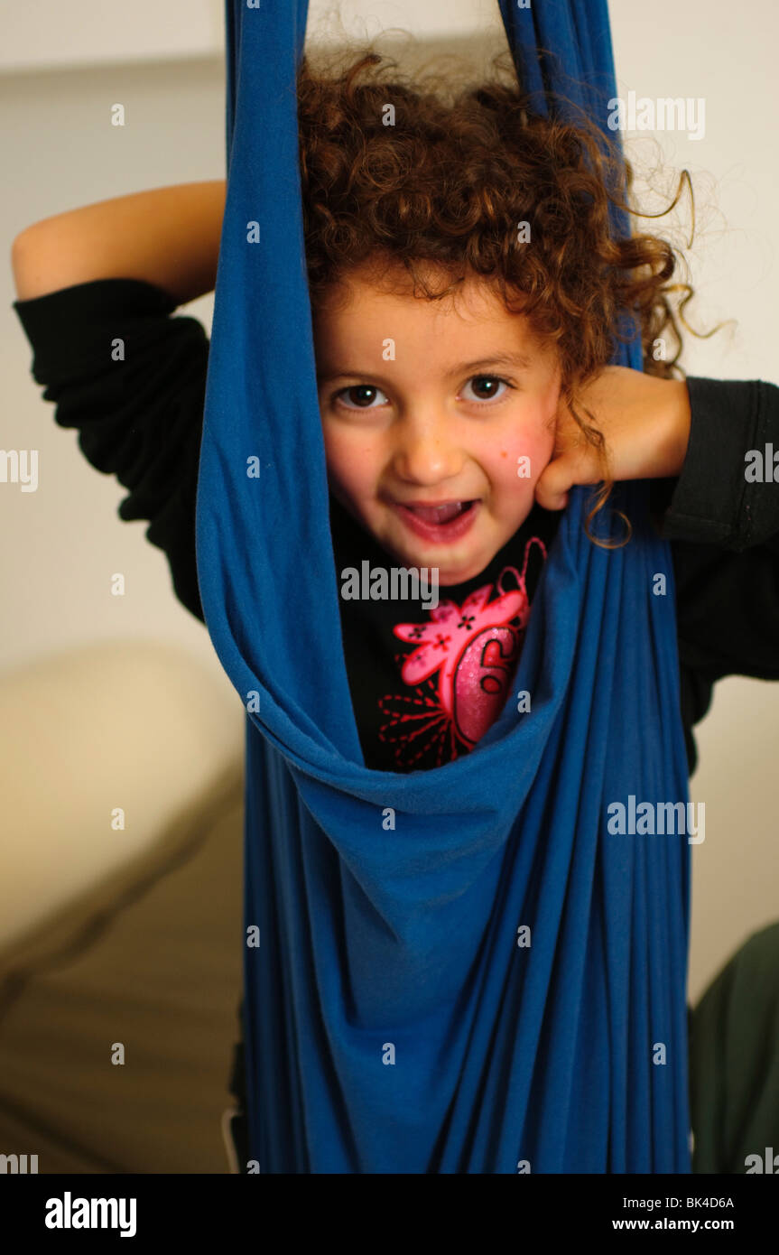 Happy and excited young girl of eight in a hanging sack Stock Photo - Alamy