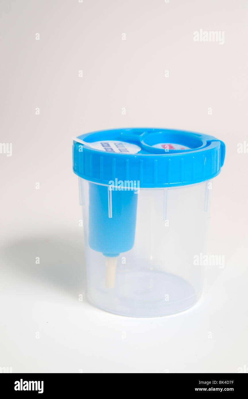 Cutout of an empty sterile Urine sample cup, close-up on white ...