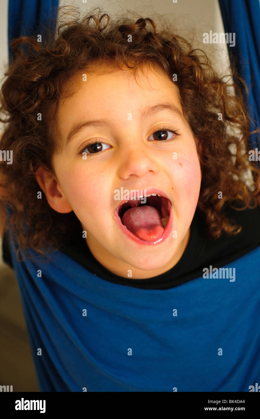 Happy and excited young girl of eight in a hanging sack Stock Photo - Alamy