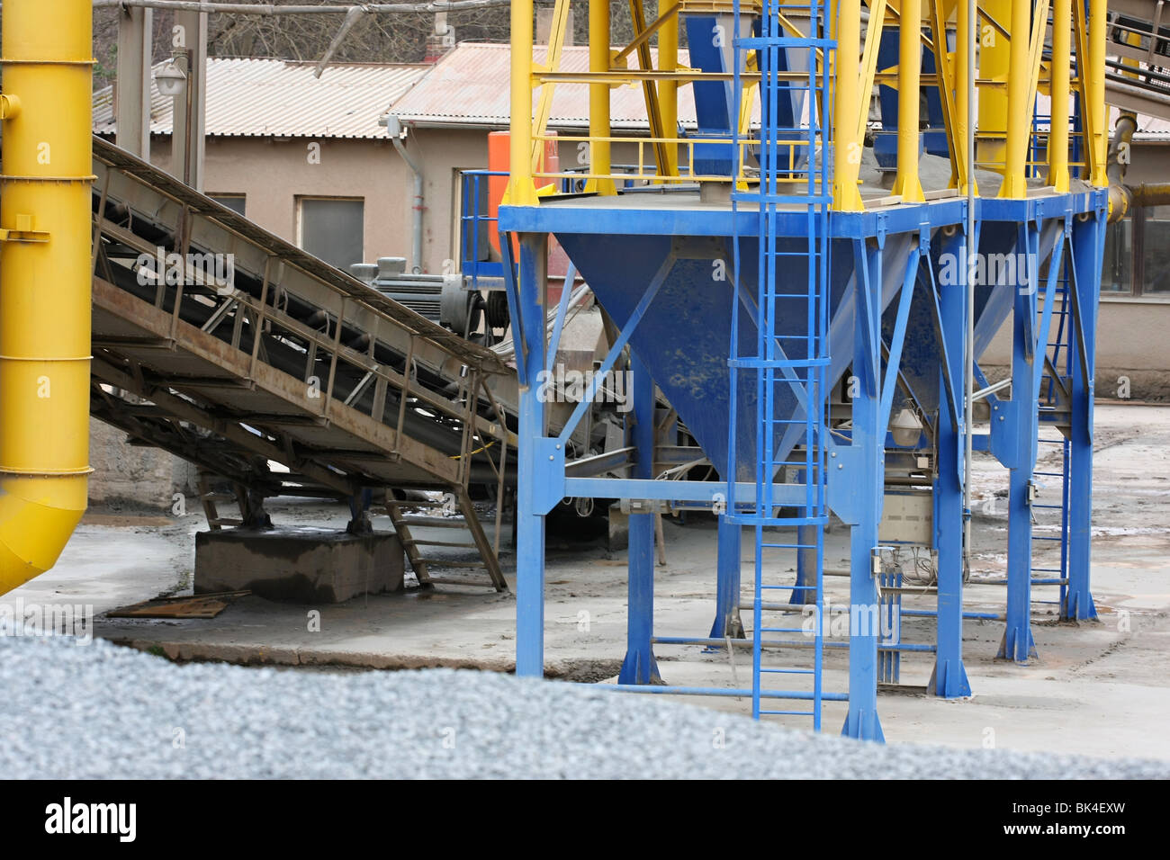 Stone quarry with silos, conveyor belts and piles of stones Stock Photo ...