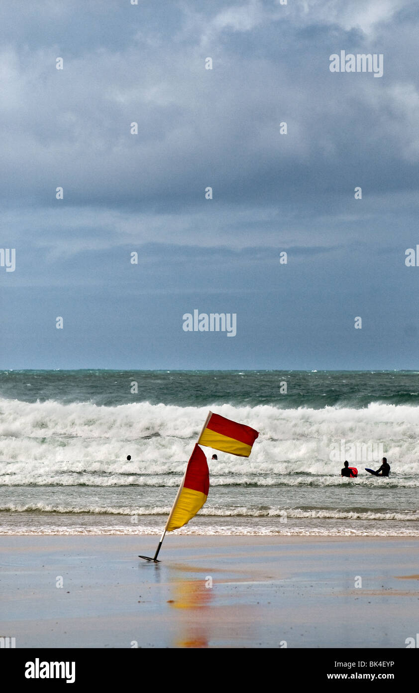 RNLI safety warning flags on Fistral Beach in Newquay in Cornwall ...